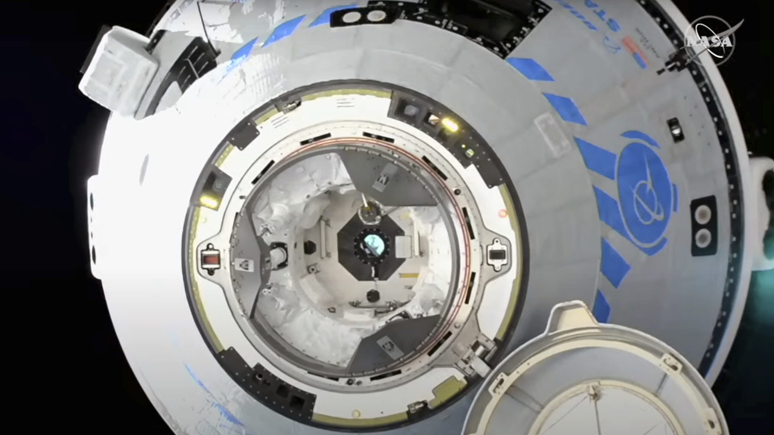 Boeing finally docks a capsule to the space station | WAMU
